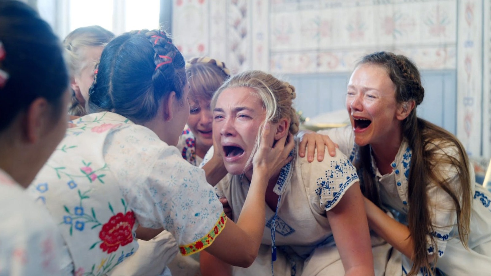 The Hidden Faces That Plague Florence Pugh's Dani In Midsommar